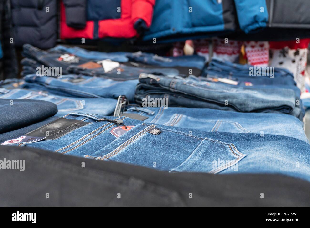 Denim pants in the mall with a security tag new fashion Stock Photo - Alamy