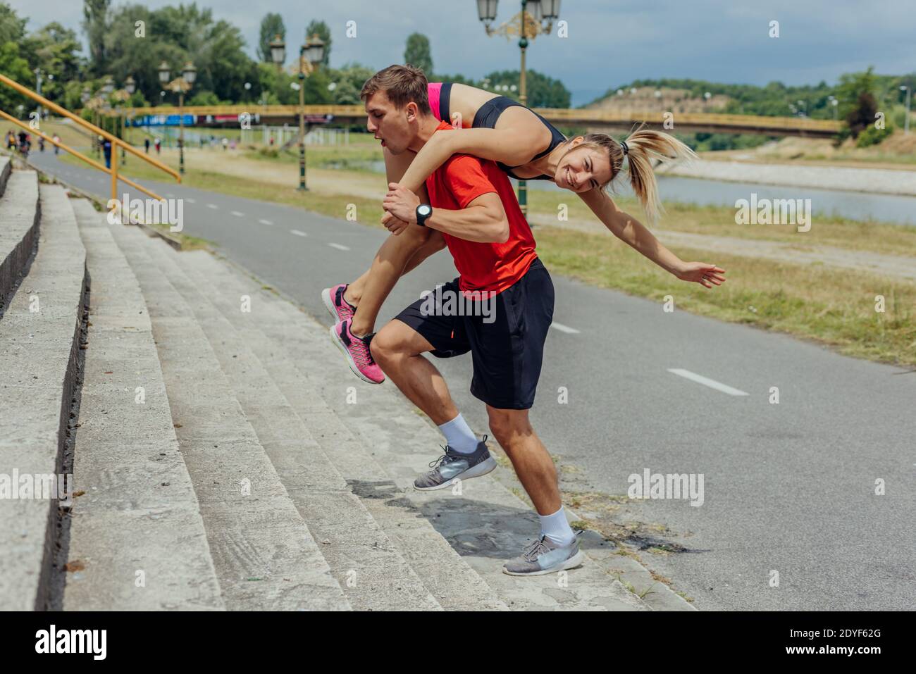 Two friends run up stairs hi-res stock photography and images - Alamy