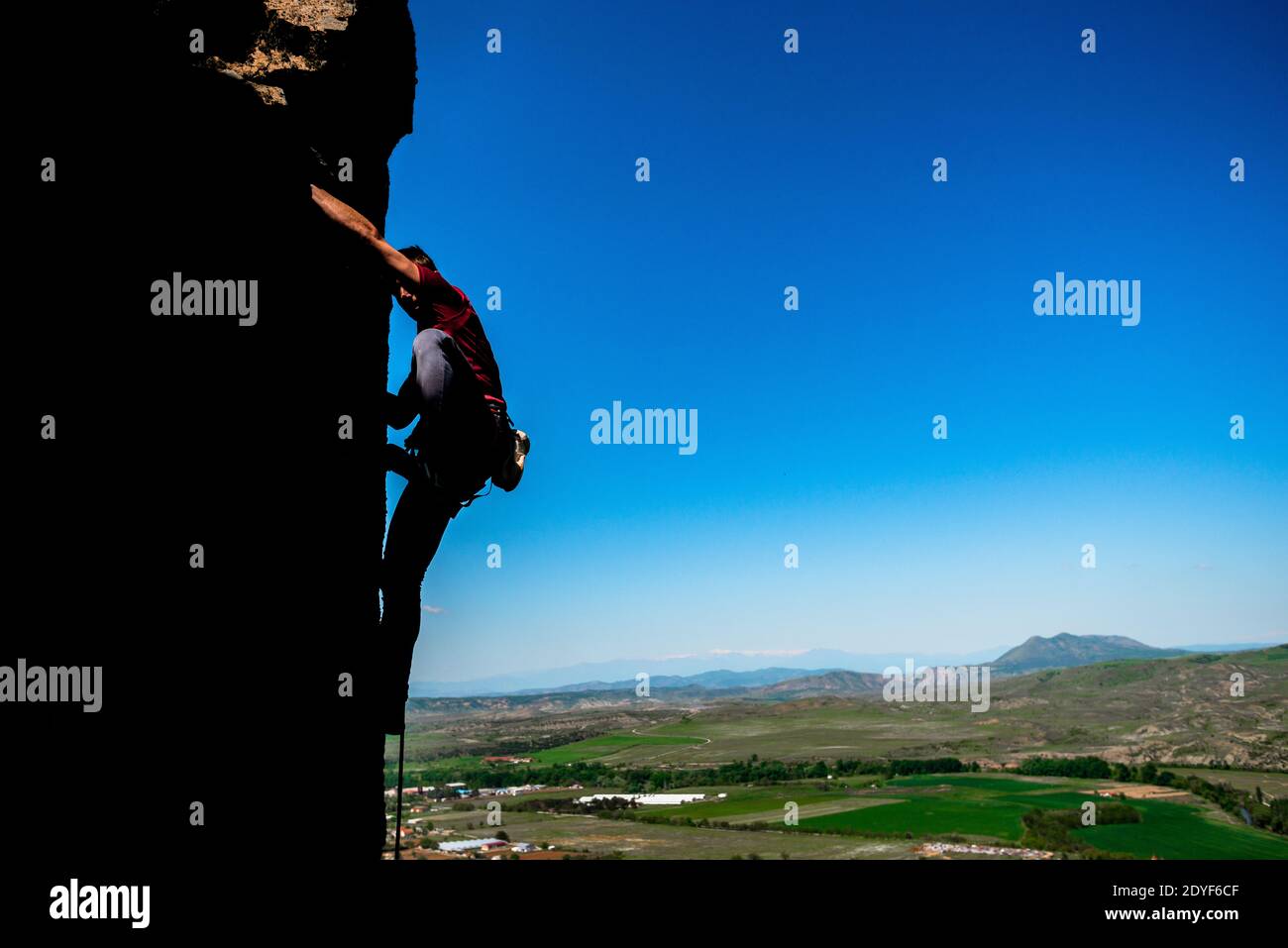 The climber makes an ascent to the top of the mountain Stock Photo - Alamy