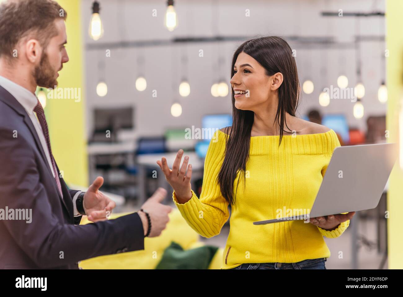 Manager explaining to his employee how to finish her tasks. Colleagues ...