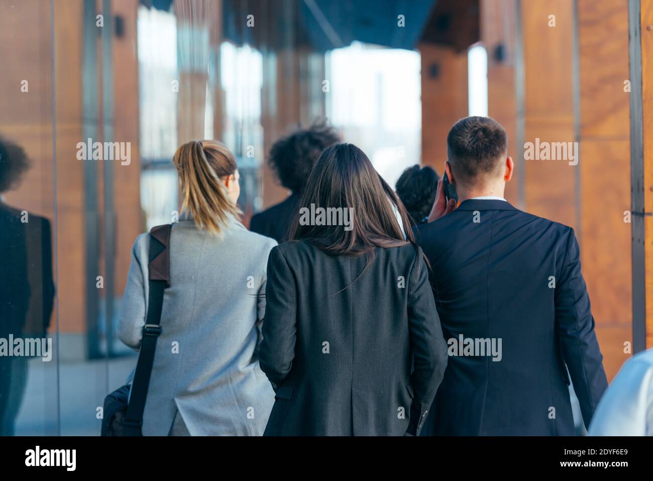Group of colleagues on a business trip (euro trip) walking together at ...