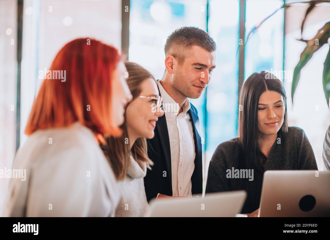 Using tablets laptops diverse group hi-res stock photography and images ...