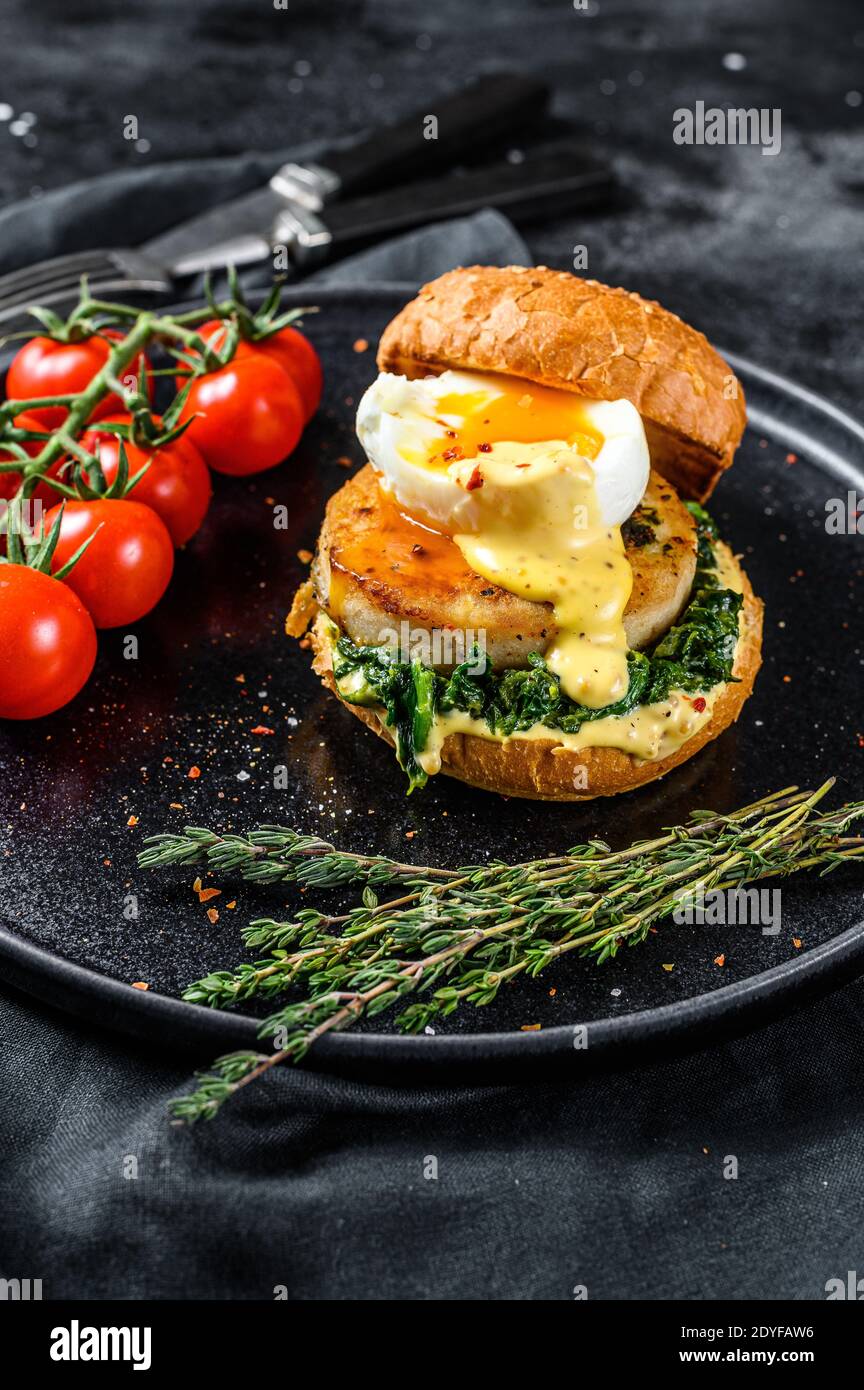 Homemade fish Burger with cod fillet, egg and spinach on a brioche bun ...