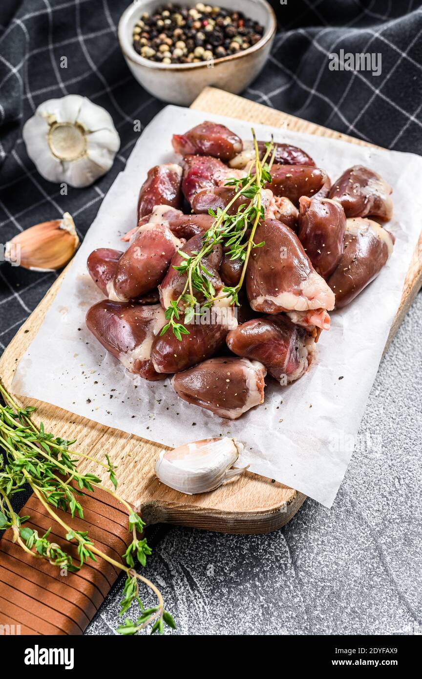 Fresh chicken hearts. Raw offals. White background. Top view Stock ...