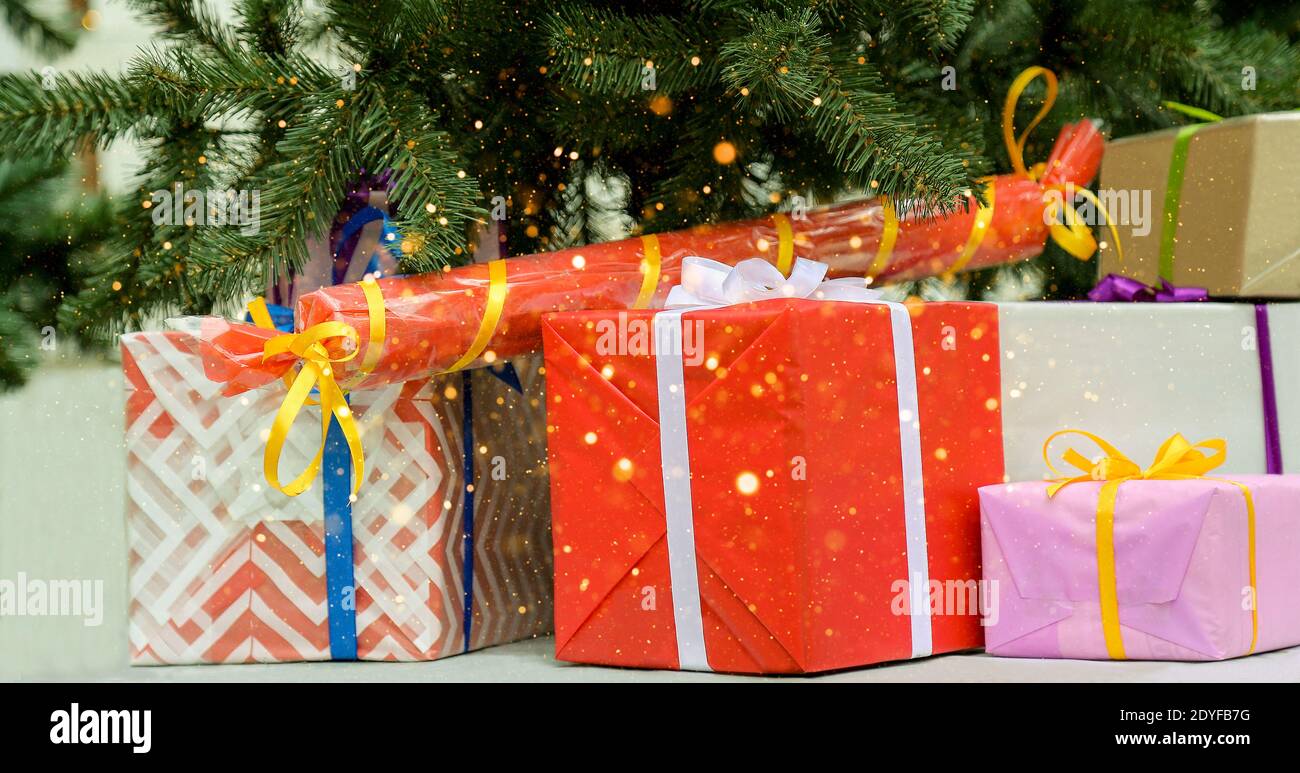 stack of gifts under a Christmas tree Stock Photo - Alamy