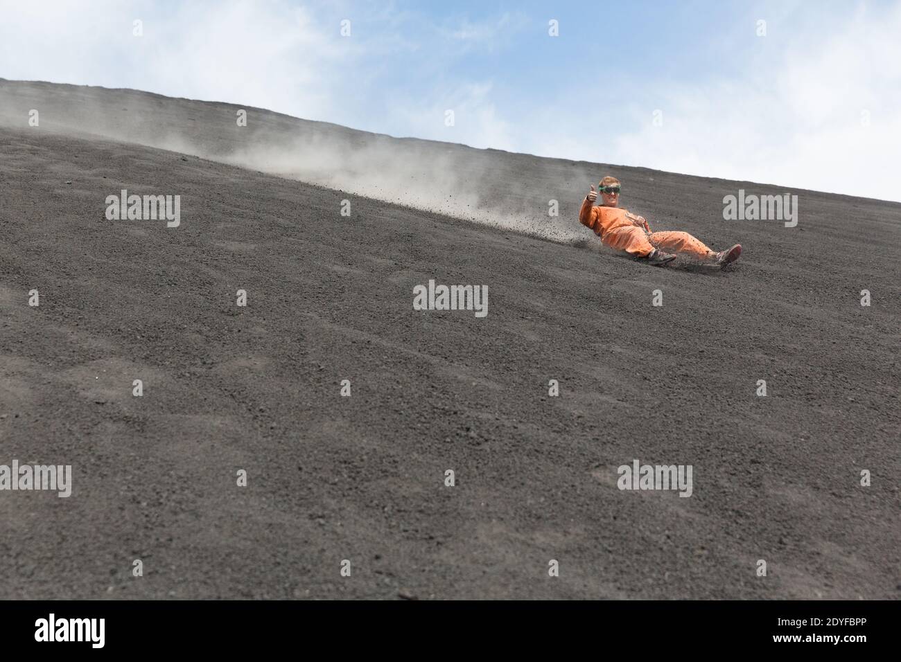 A Volcano surfer slides down Cerro Negro Volcano Stock Photo - Alamy