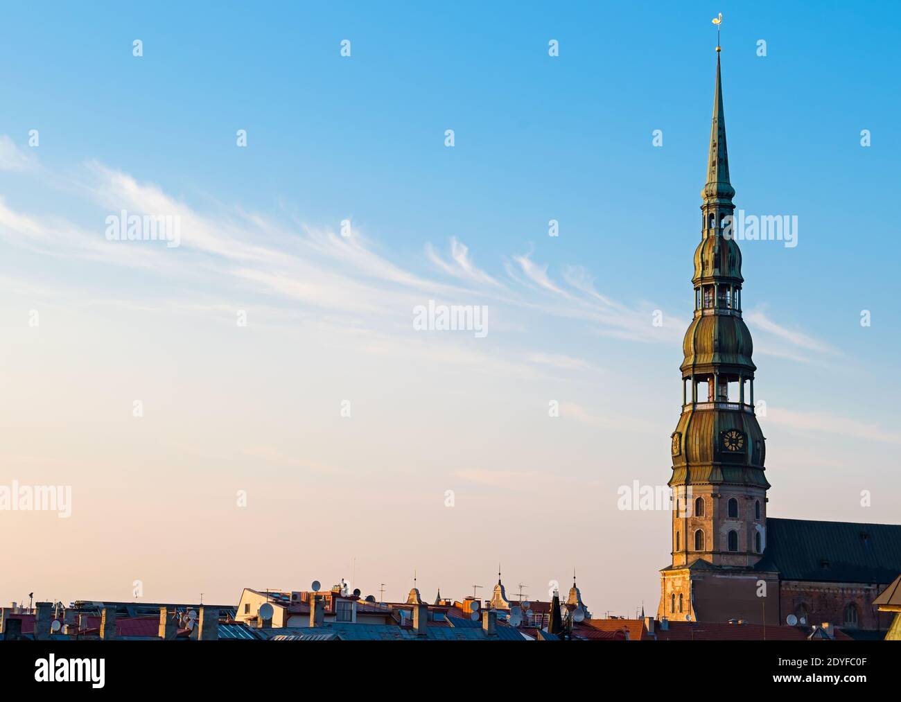 Symbol of Riga, old clock on medieval church tower of St. Peters among ...