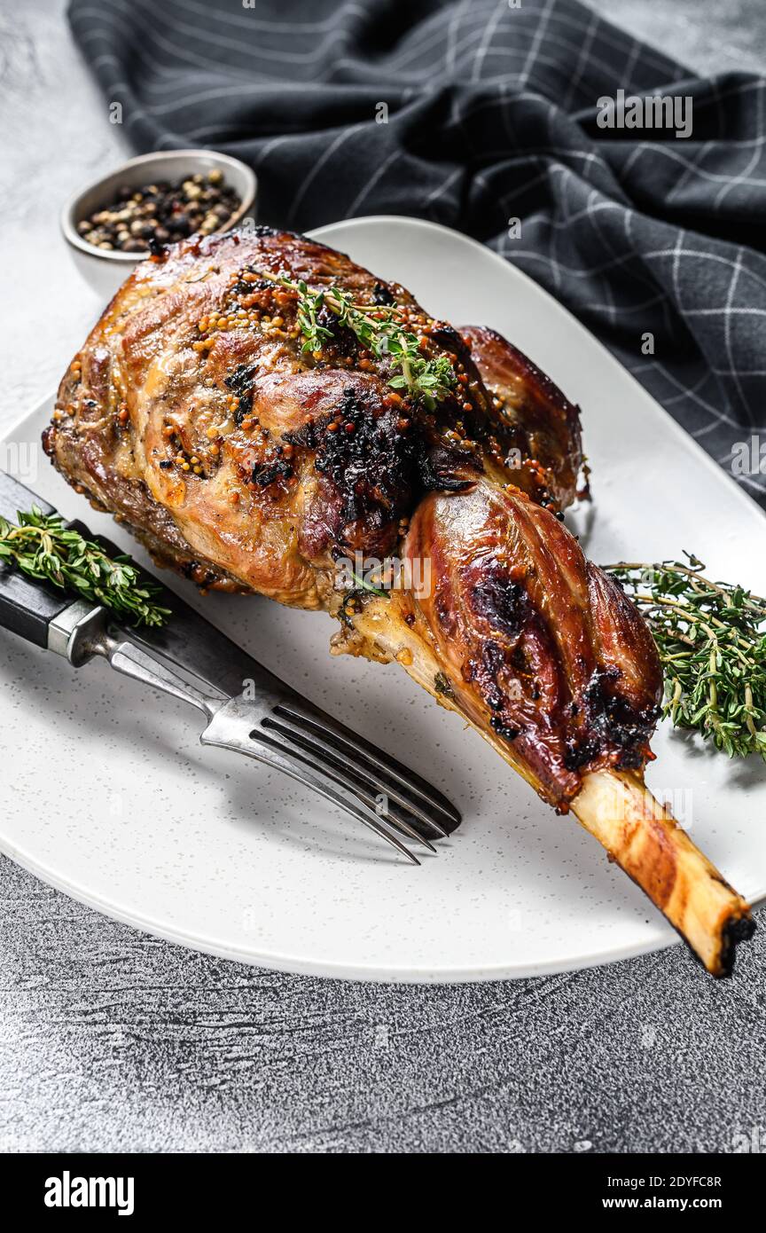 Baked goat leg with herbs. Farm meat. Gray background. Top view Stock ...
