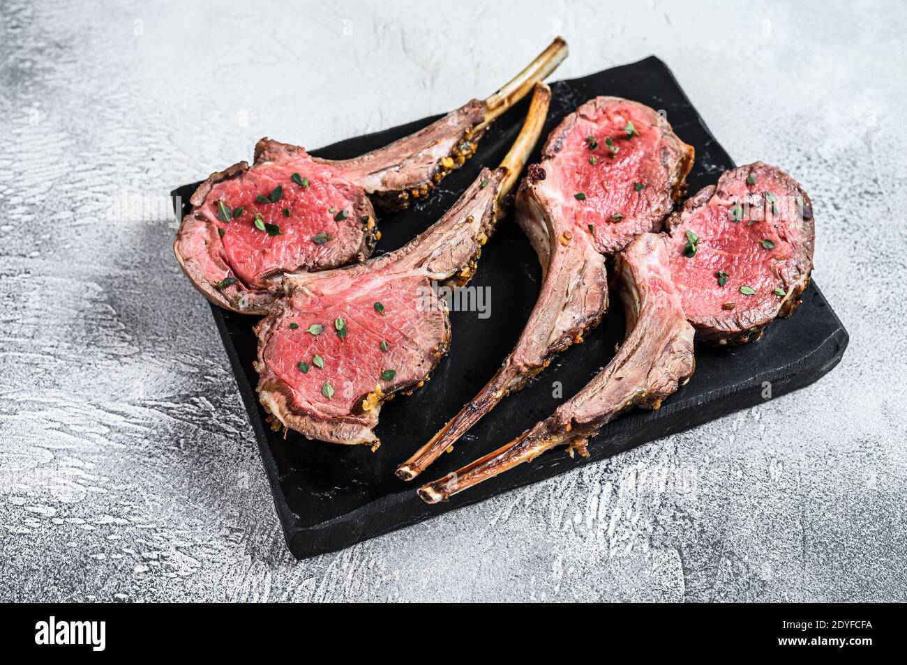 Baked lamb chop meat steaks. White background. Top view Stock Photo - Alamy