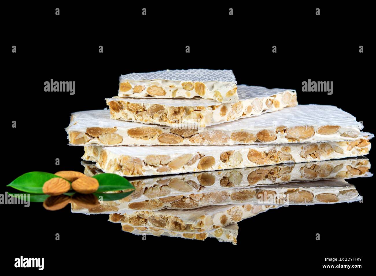 Spanish traditional sweet turron of white base with almonds on the ...