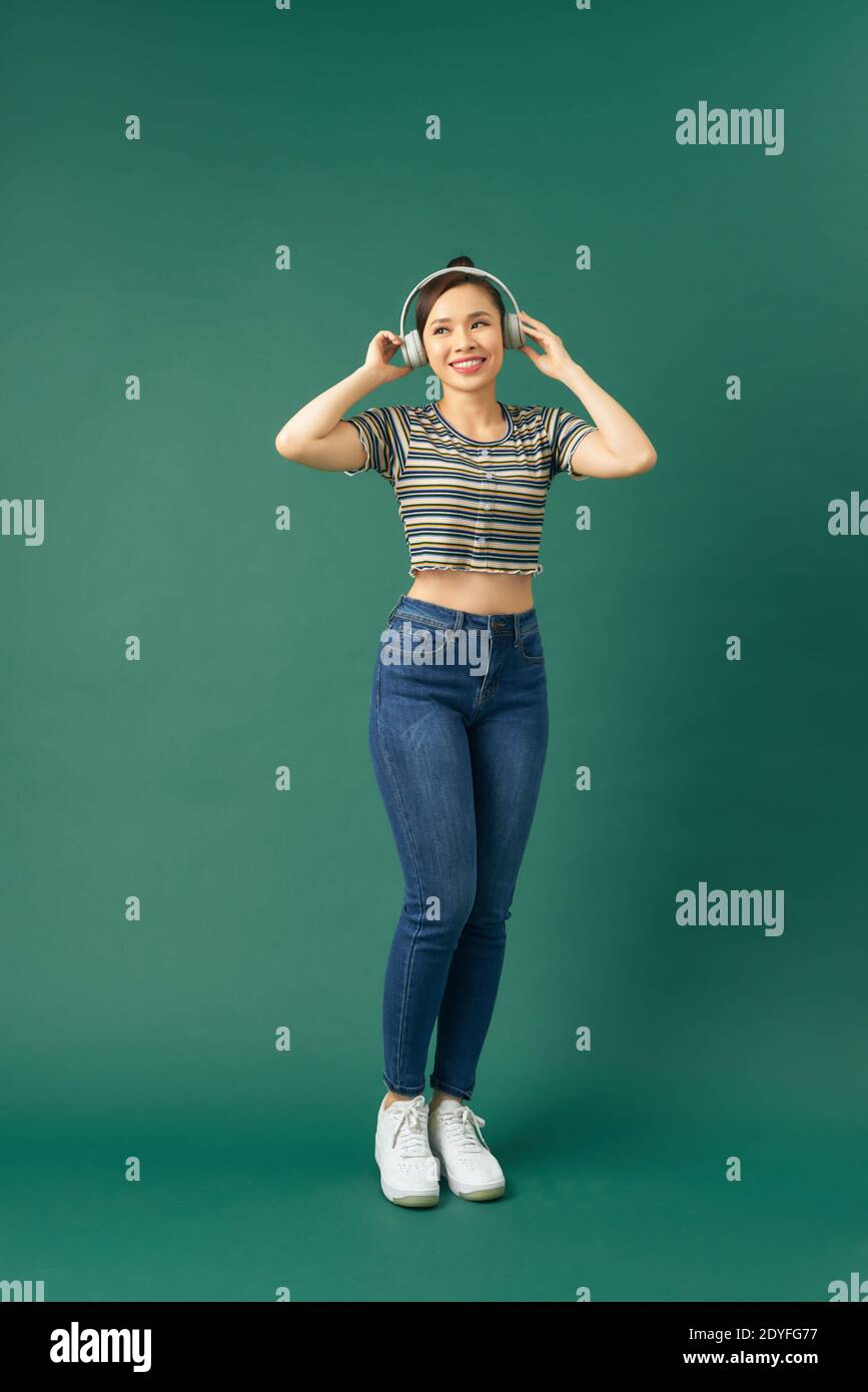 Full length body size photo of beautiful girl listening to music with ...