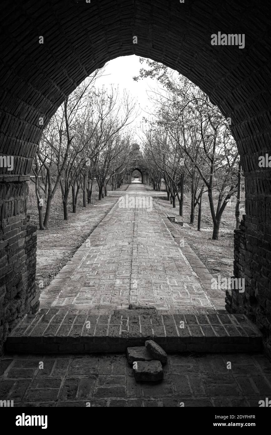 Gate leading onto stone path Stock Photo - Alamy