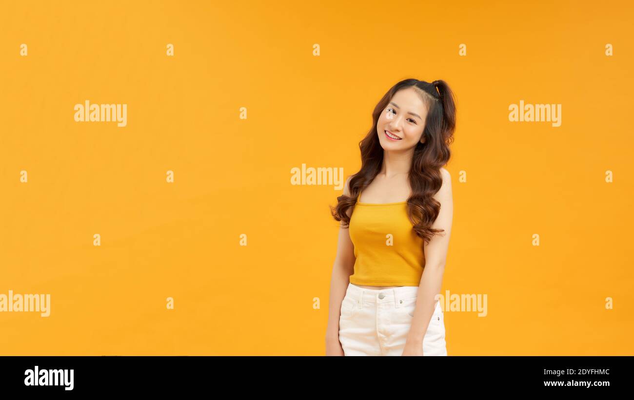 Beautiful young girl in dress on color background Stock Photo - Alamy