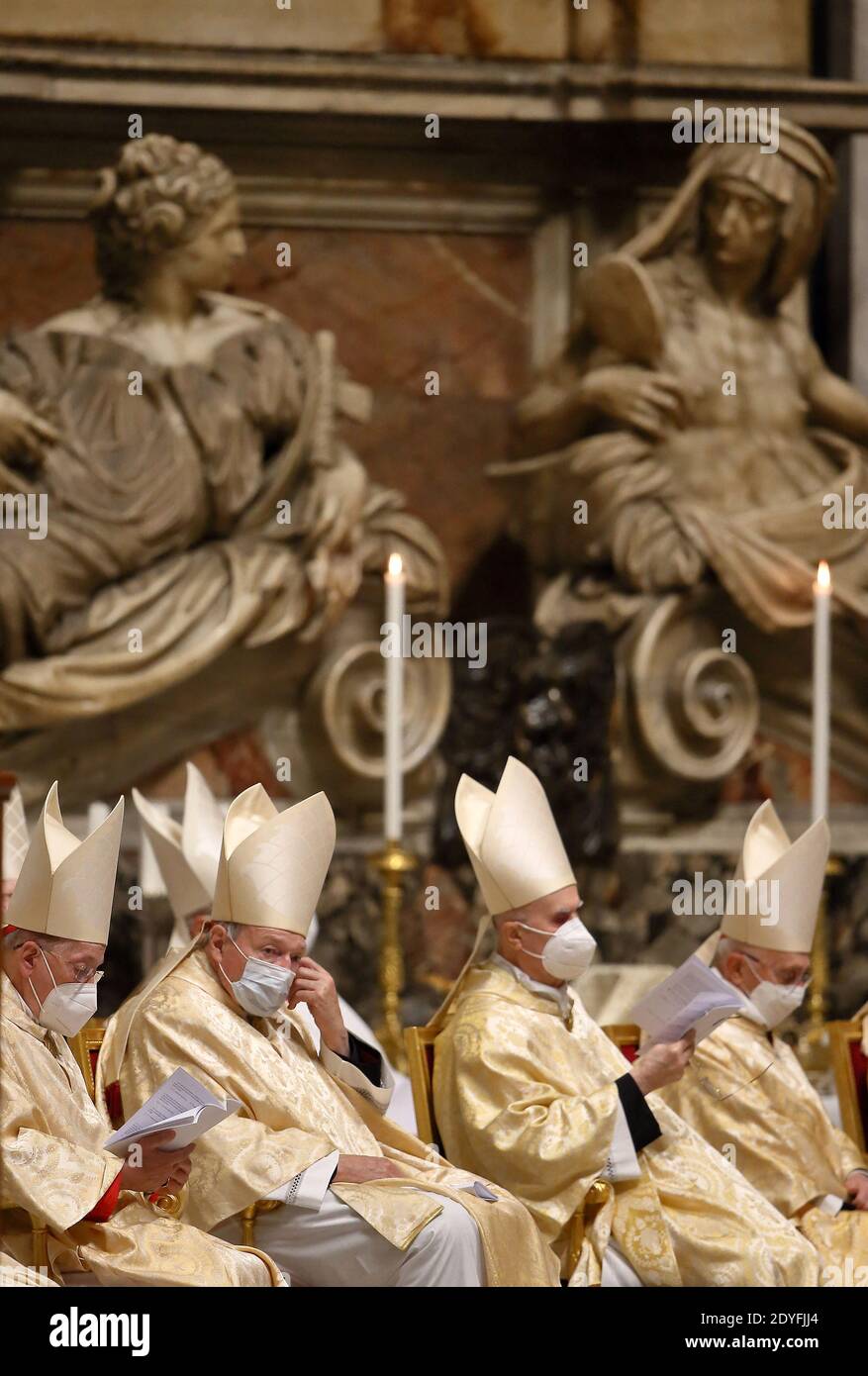 Cardinals wearing face masks attend the Christmas Eve Mass celebrated ...