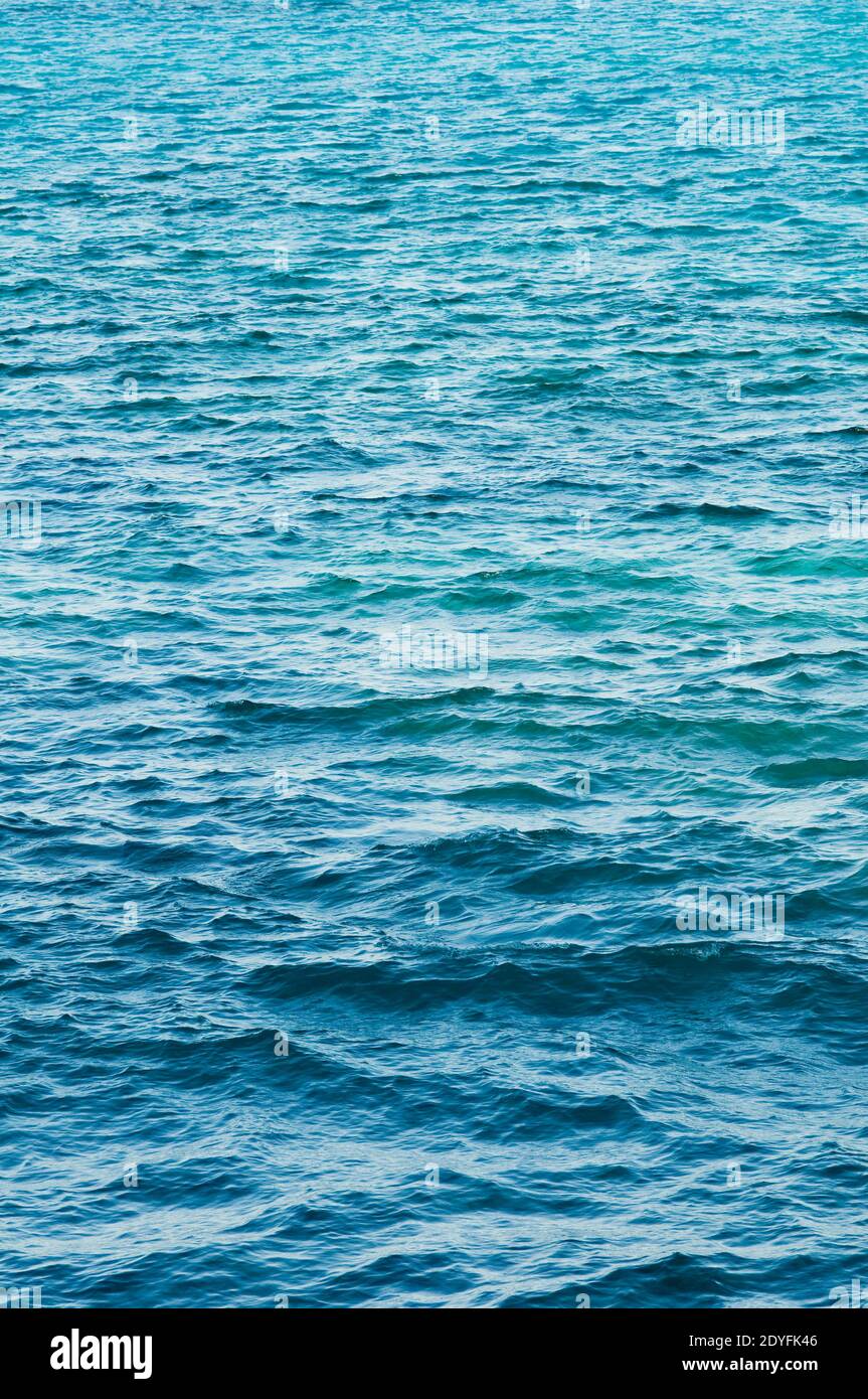Ripple on the surface of the ocean water close-up. Blue sea background ...
