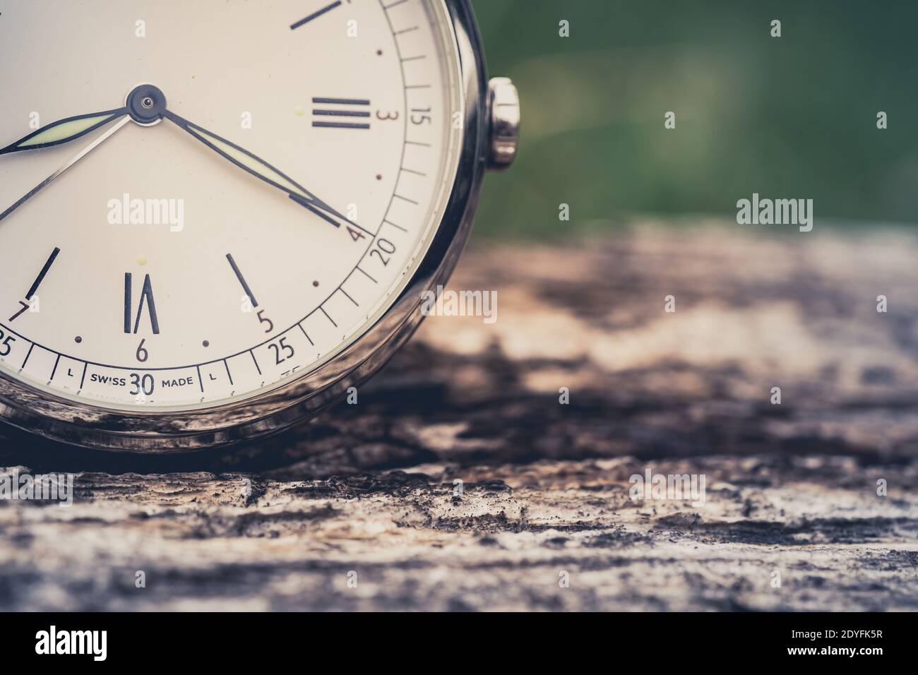 Vintage clock on a wooden background. Old watch as a symbol of passing ...
