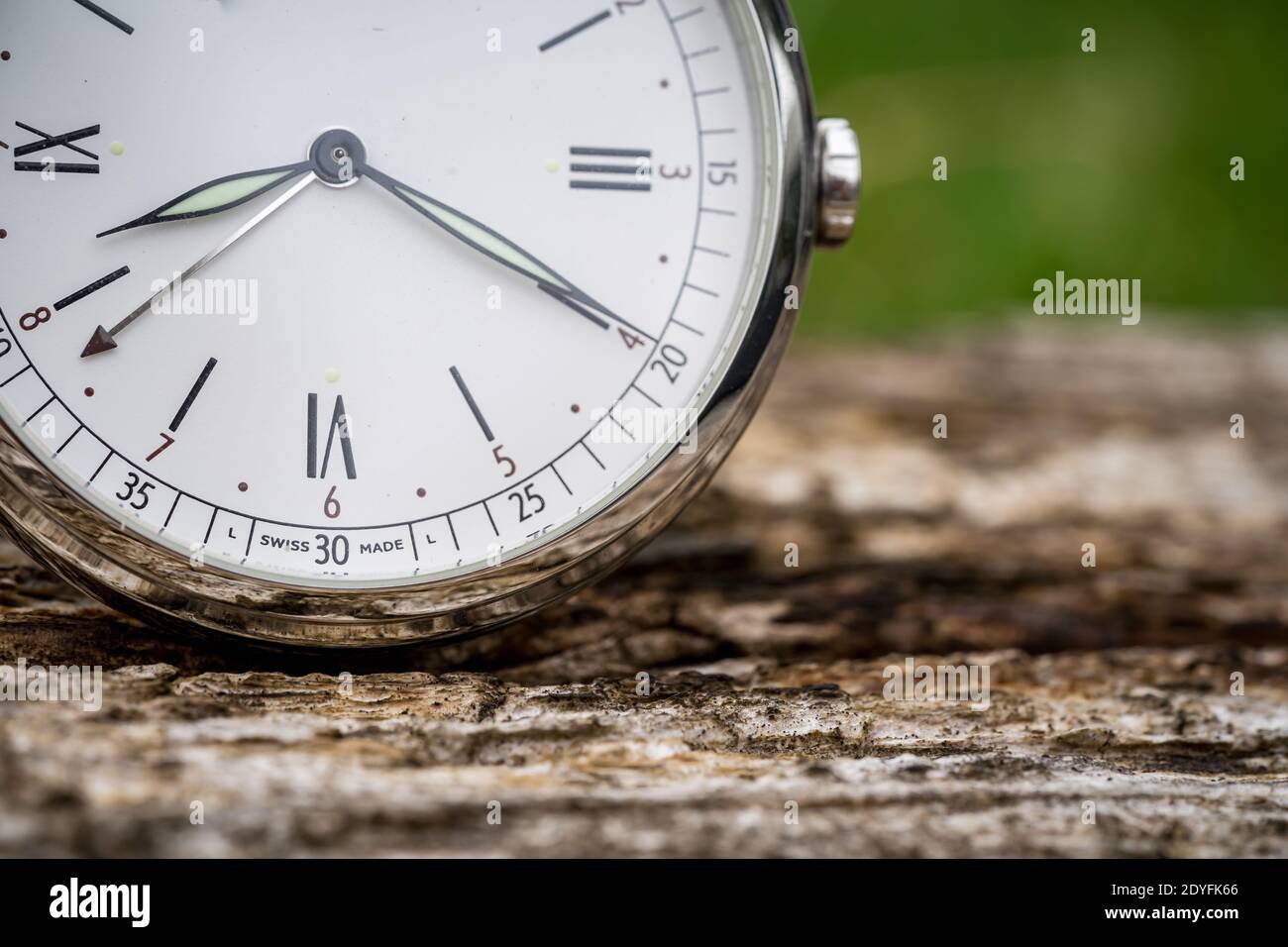Vintage clock on a wooden background. Old watch as a symbol of passing ...
