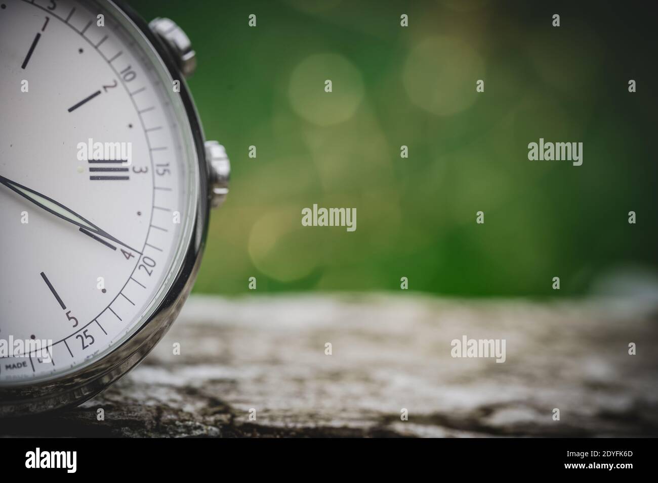Vintage clock on a wooden background. Old watch as a symbol of passing ...