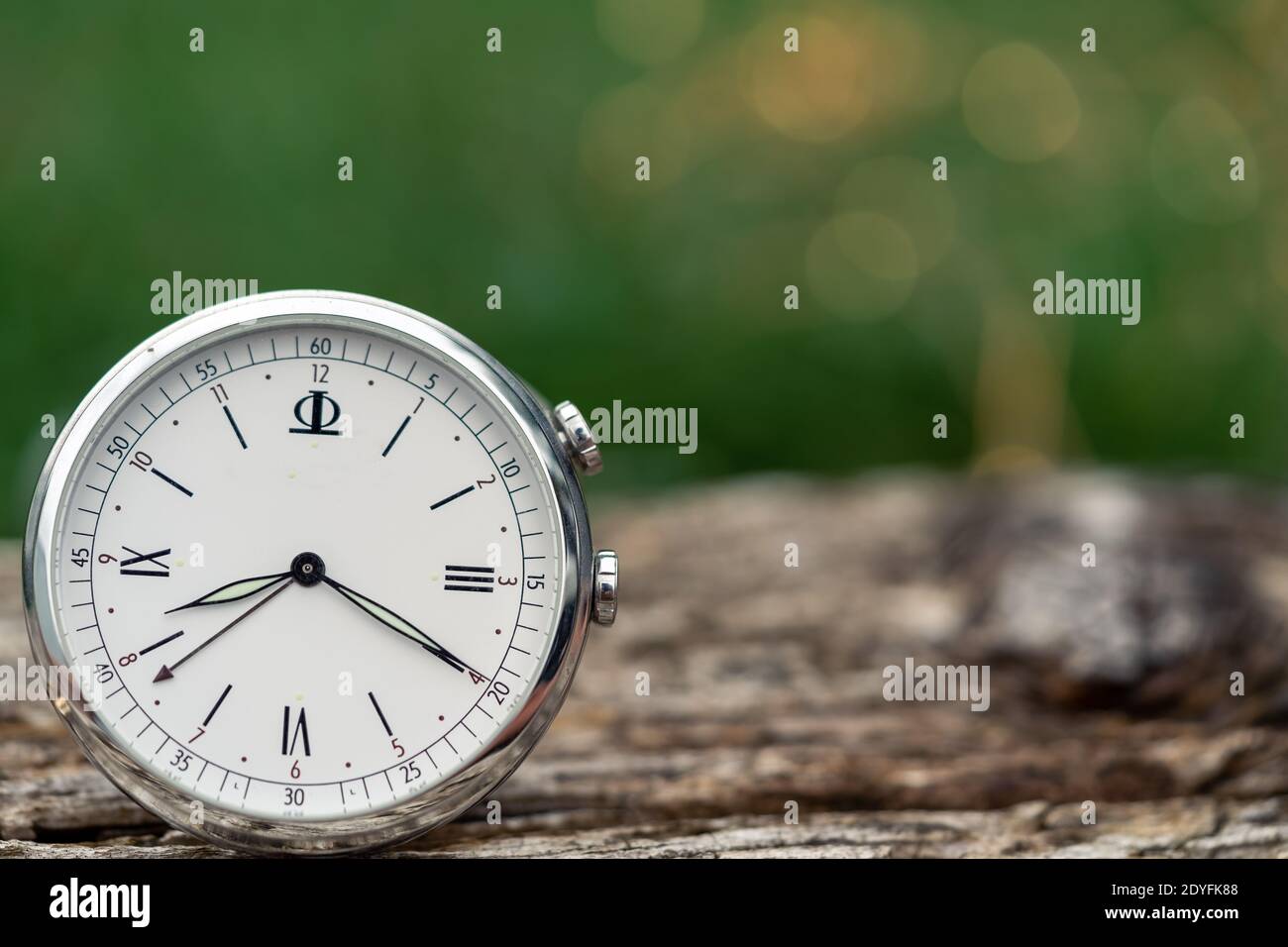 Vintage clock on a wooden background. Old watch as a symbol of passing ...