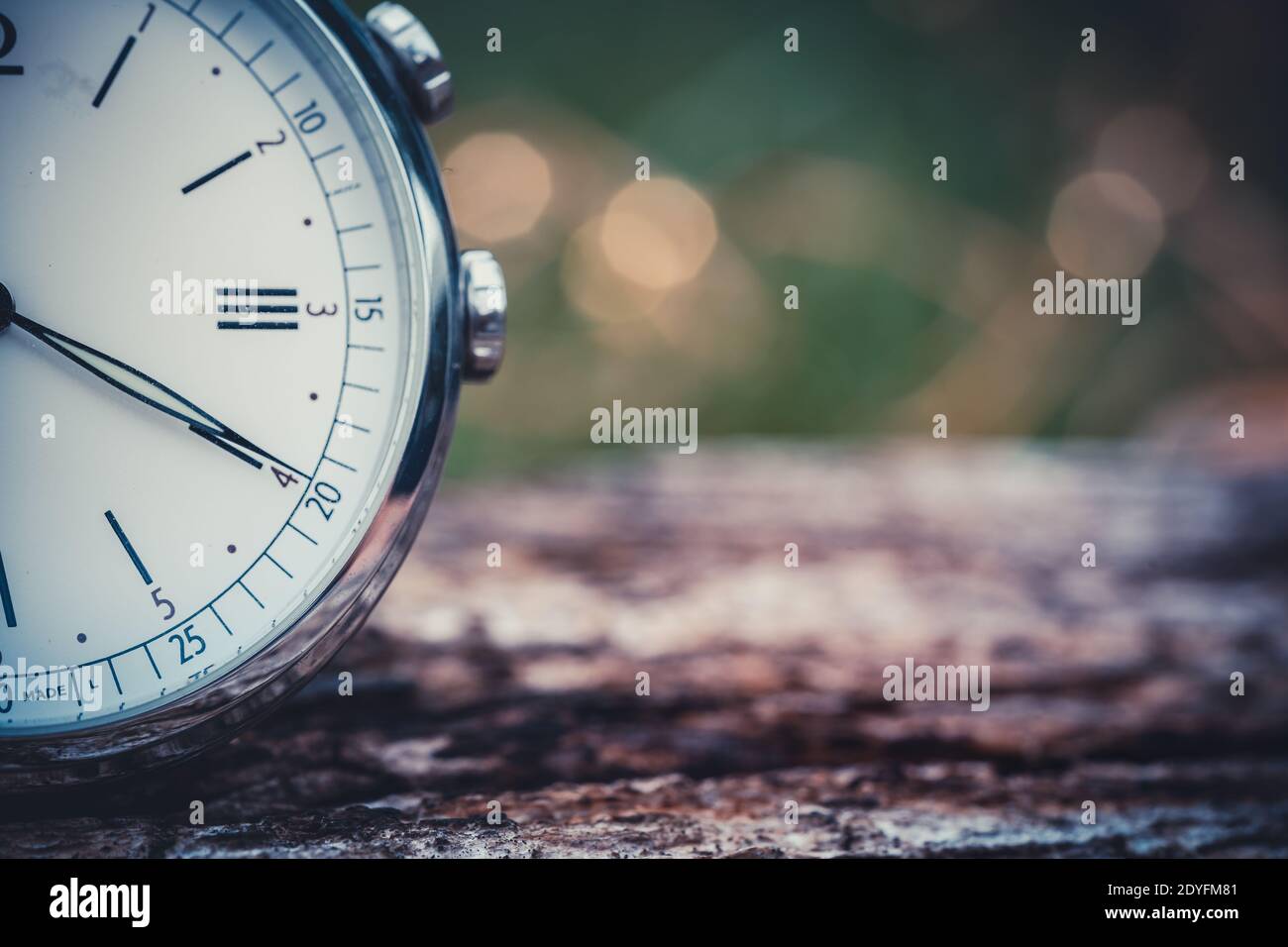 Vintage clock on a wooden background. Old watch as a symbol of passing ...