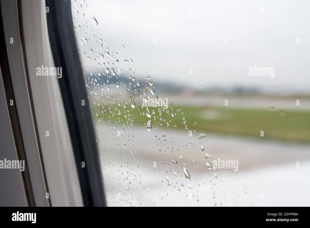 Water drops on glass aircraft hi-res stock photography and images - Alamy