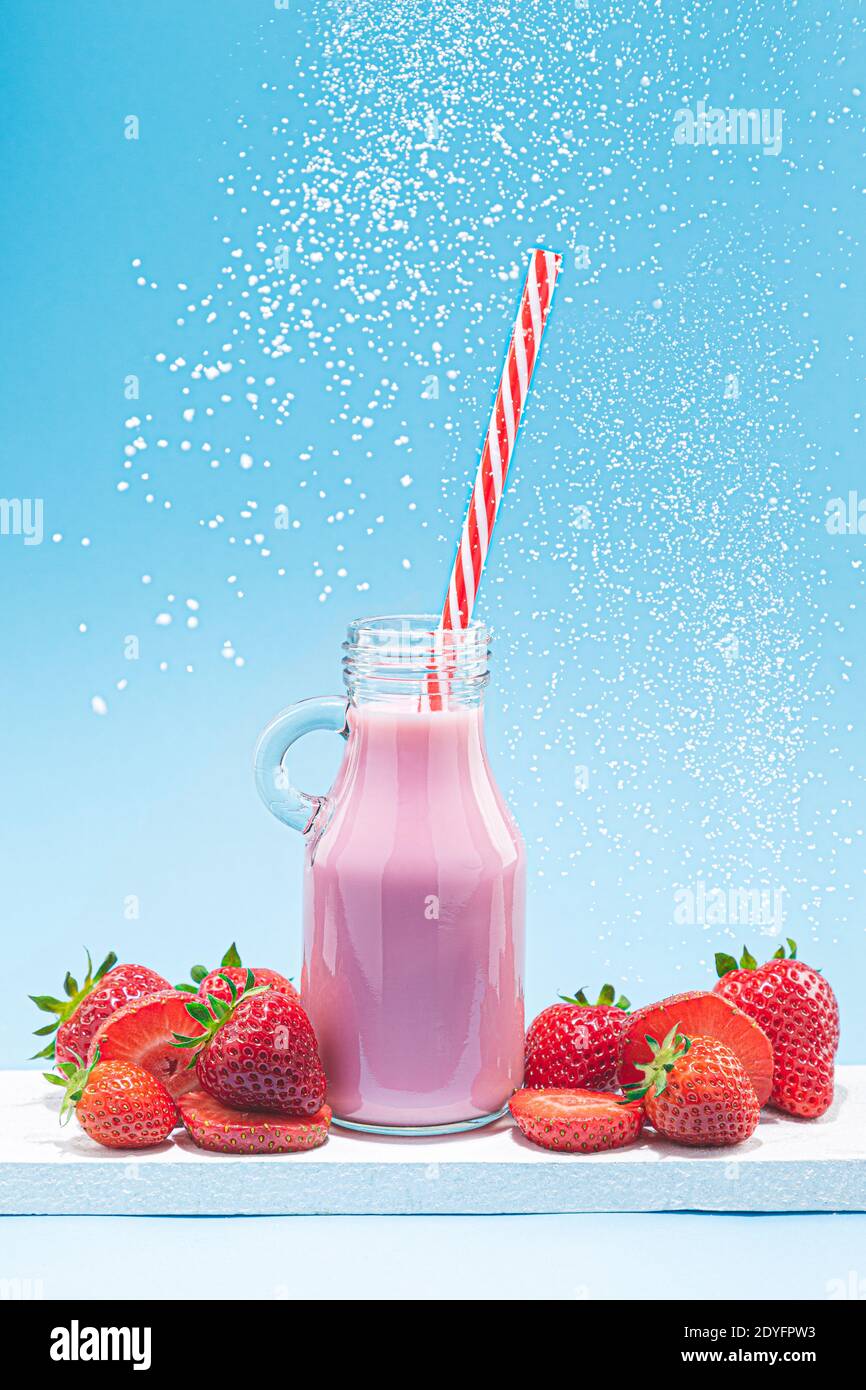 Strawberry Milk Shake Pitcher with Straw, strawberries and flying sugar ...