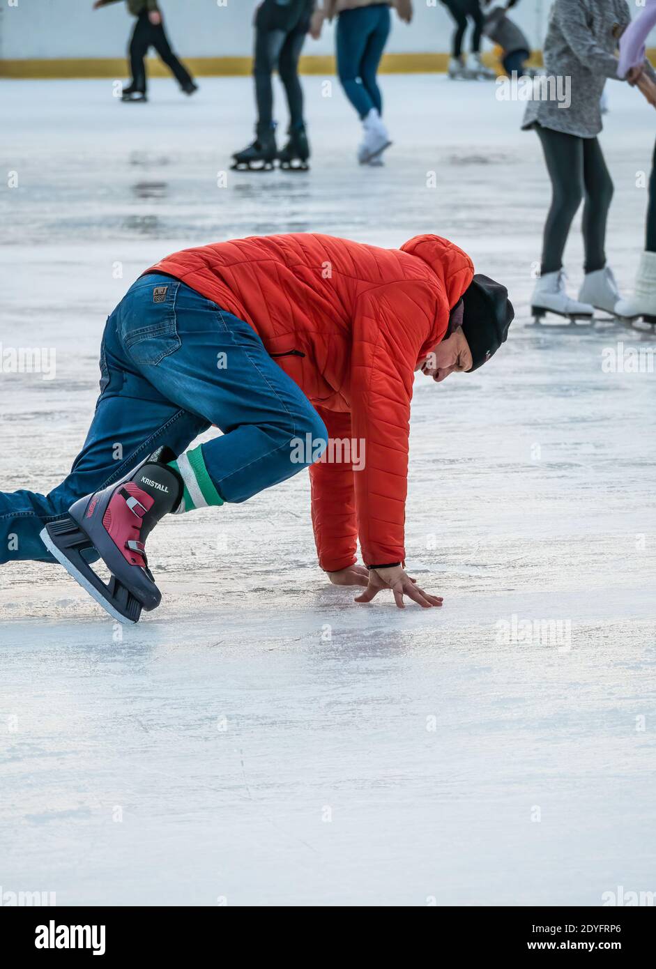 Bucharest Romania - 12.25.2020:Man on ice skates falling on the ice ...