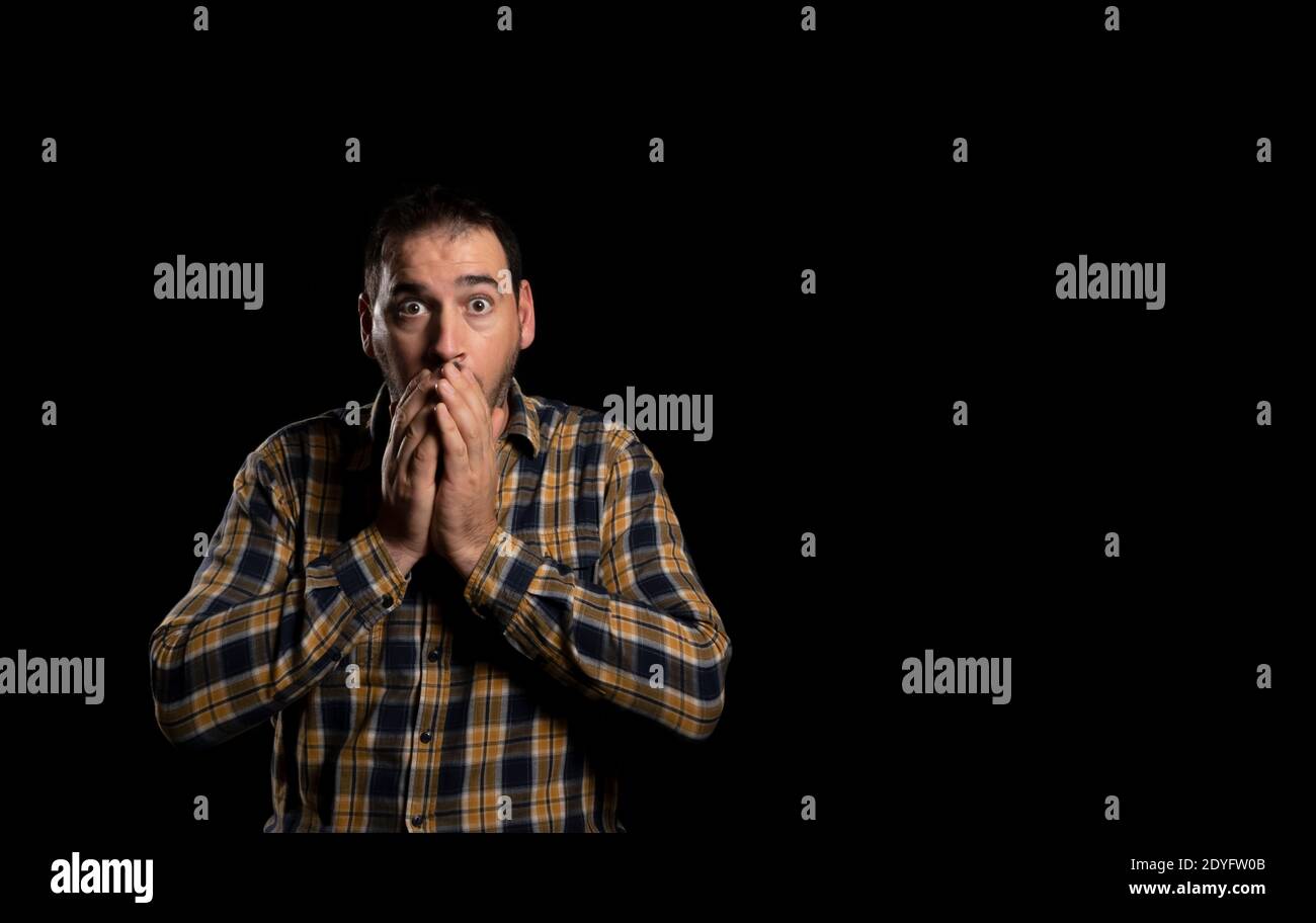 I'm scared. Scare. Portrait of the scared man. Isolated man on a black ...