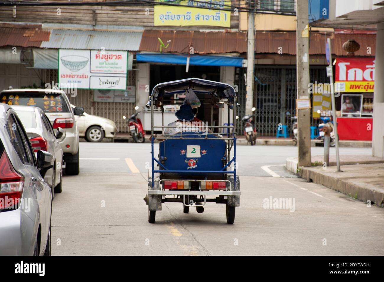 Thai people driver driving tricycle send recive passengers on street in ...