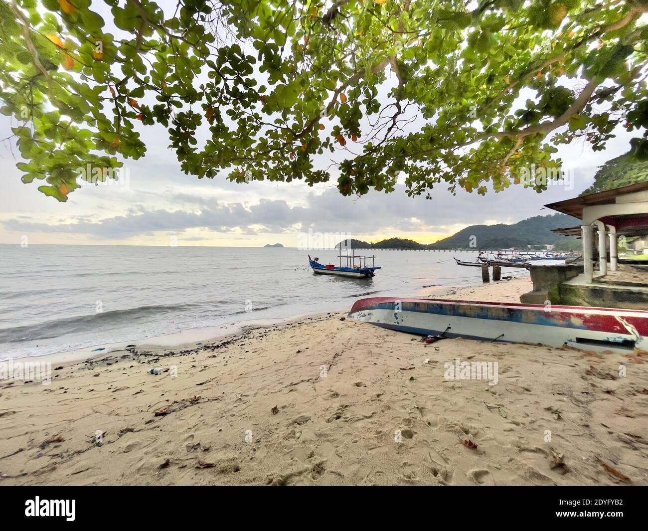 Fishing boat near a fishing village in the Teluk Kumbar Beach, Penang ...