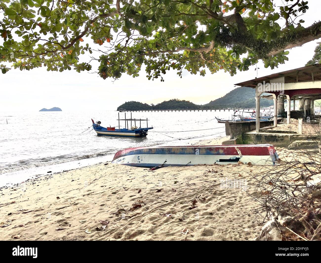 Fishing boat near a fishing village in the Teluk Kumbar Beach, Penang ...