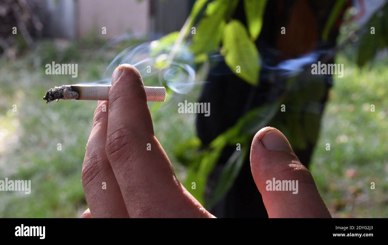 Smoldering cigarette hi-res stock photography and images - Alamy