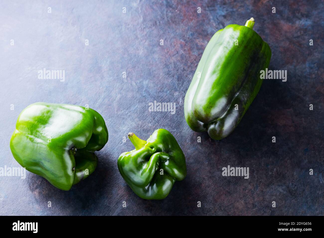 Ugly bell pepper on dark background. Deformed homegrown green bell ...