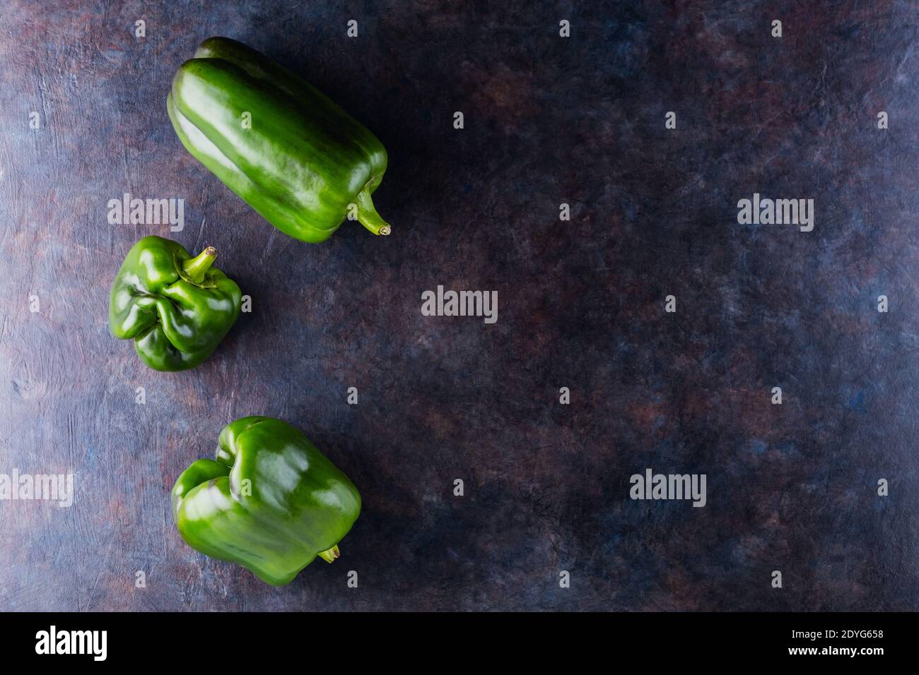 Ugly bell pepper on dark background. Deformed homegrown green bell ...