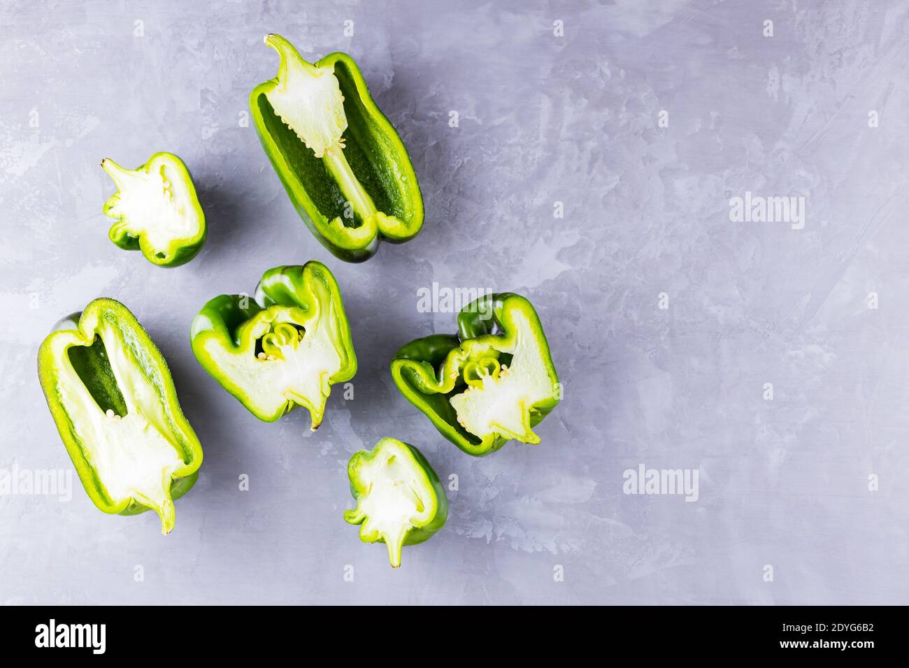 Ugly bell pepper on ultimate gray background. Sliced bell pepper halves ...