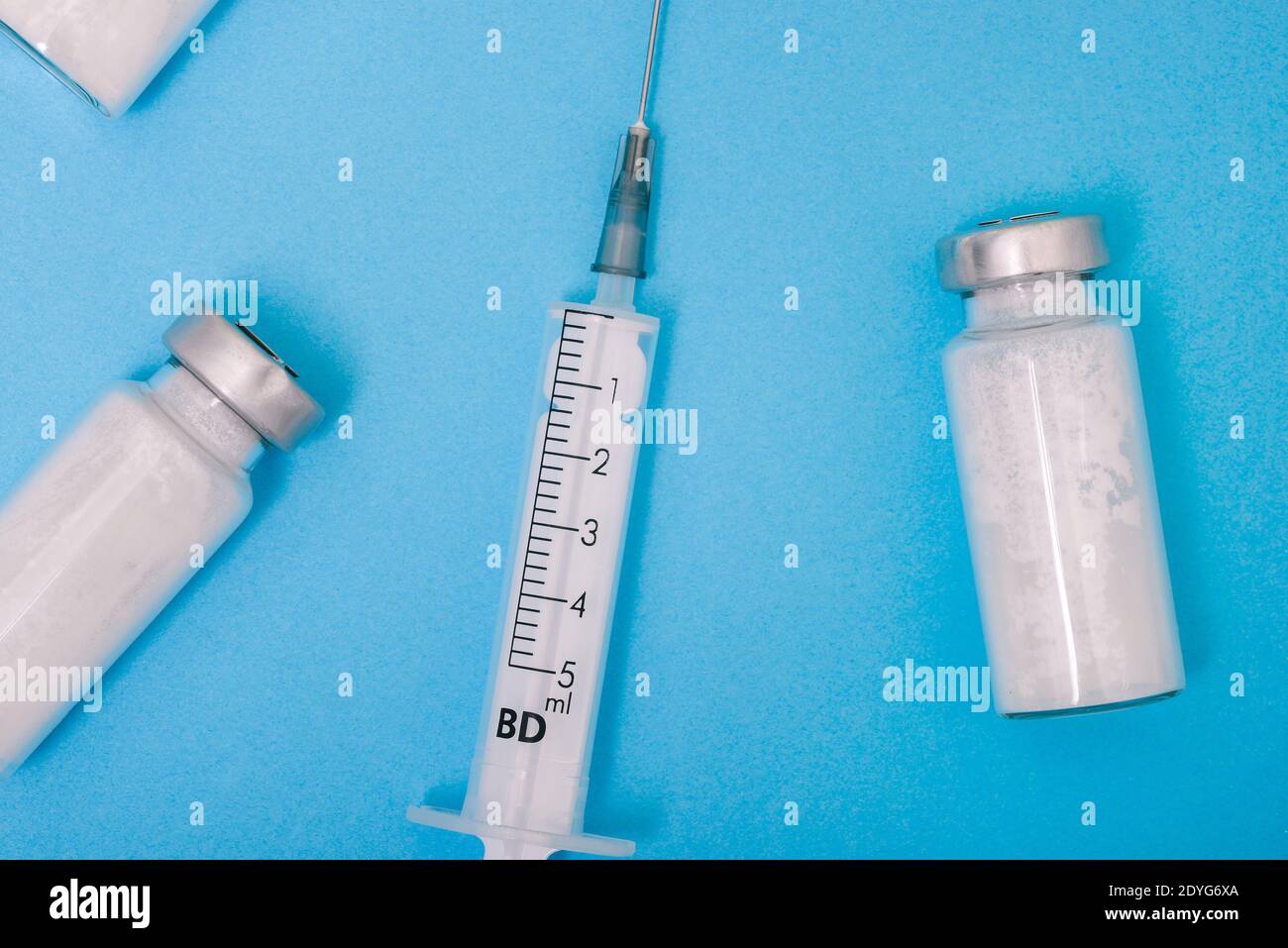 Antibiotic glass bottle and medical syringe. White powder for injection ...