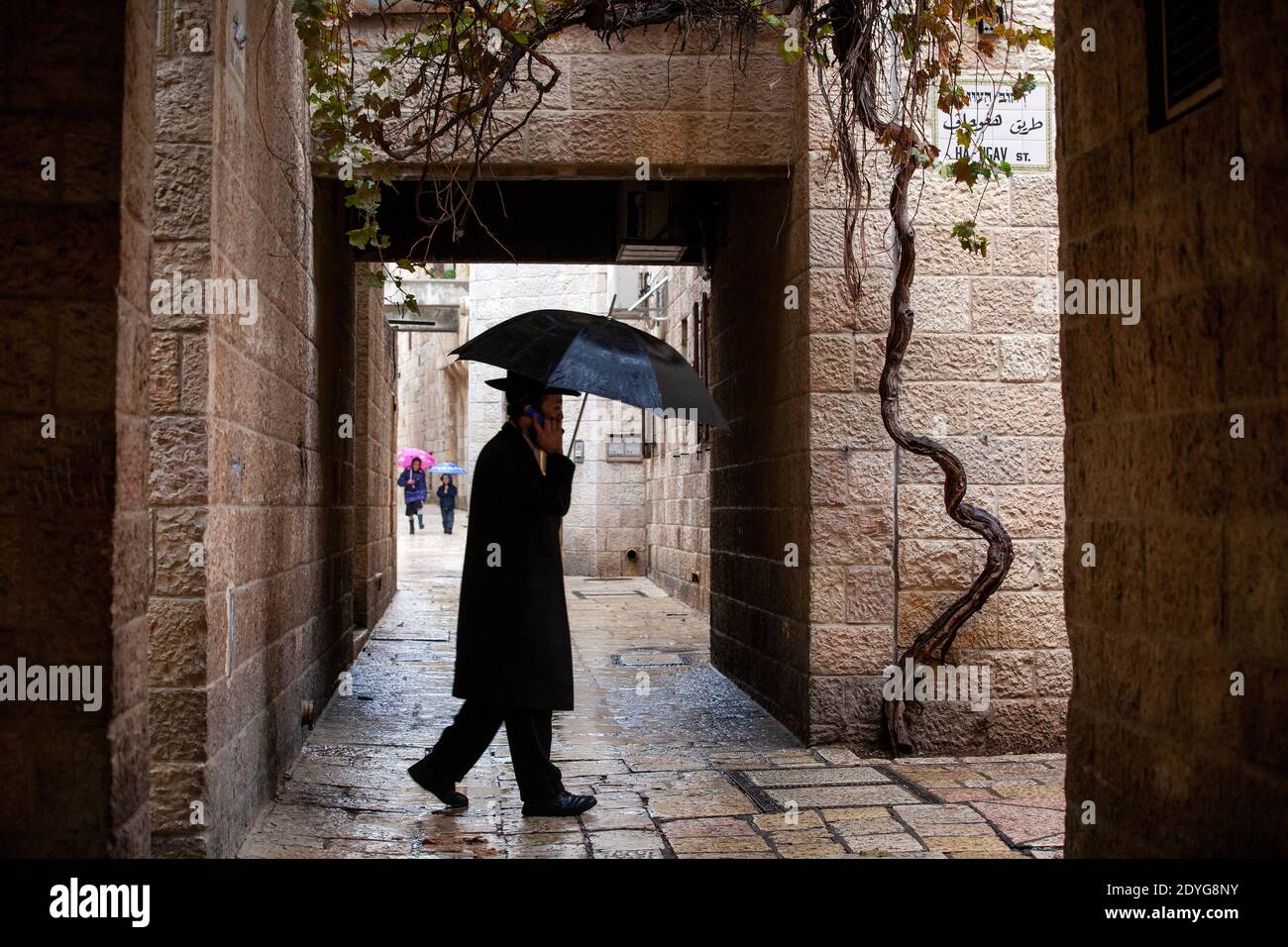 Orthodox Jews walk along a street in the oldtown of Jerusalem city in ...