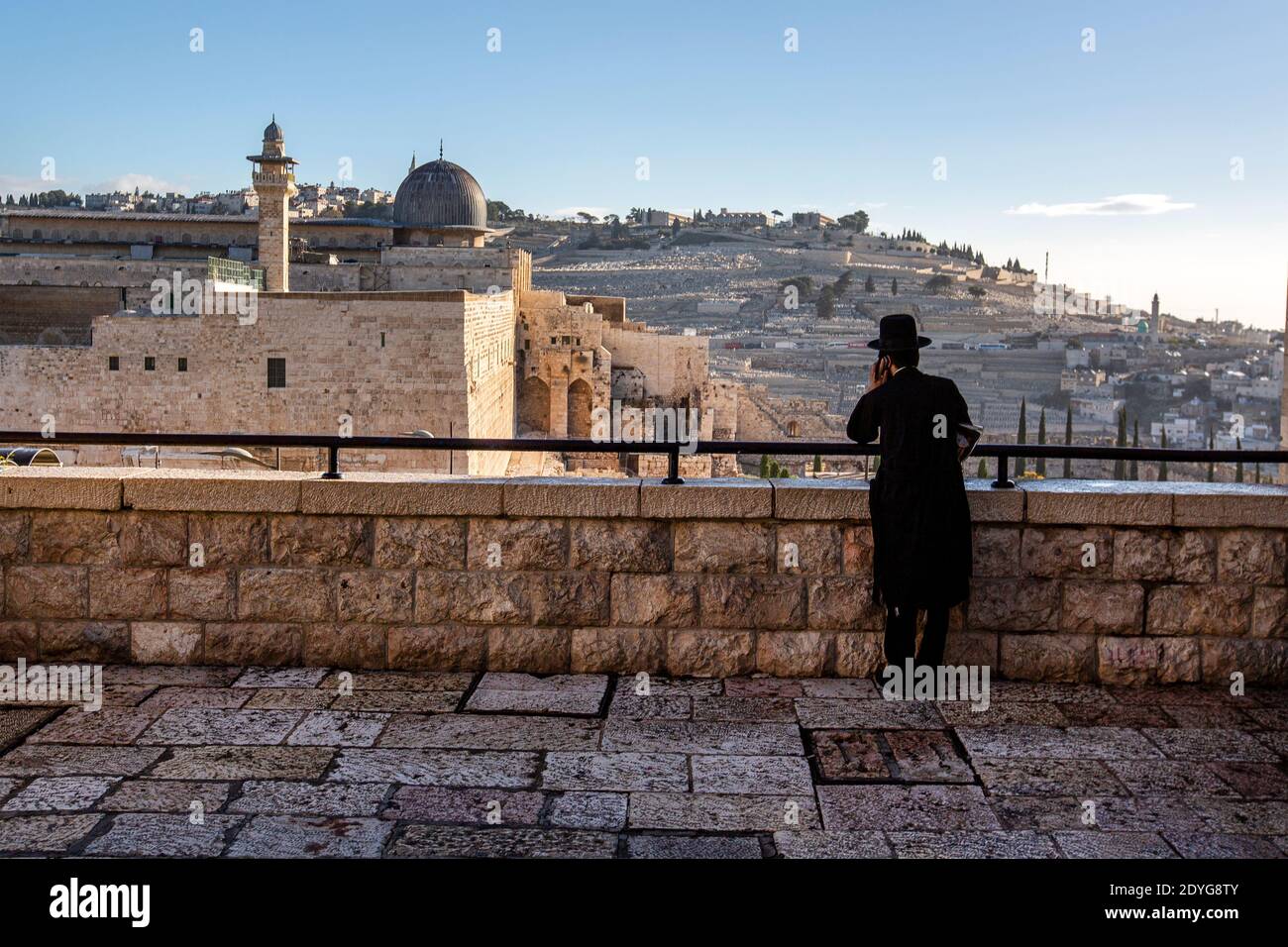 A Ultra Orthodox Jew standing in front of the Western Wall, Temple ...