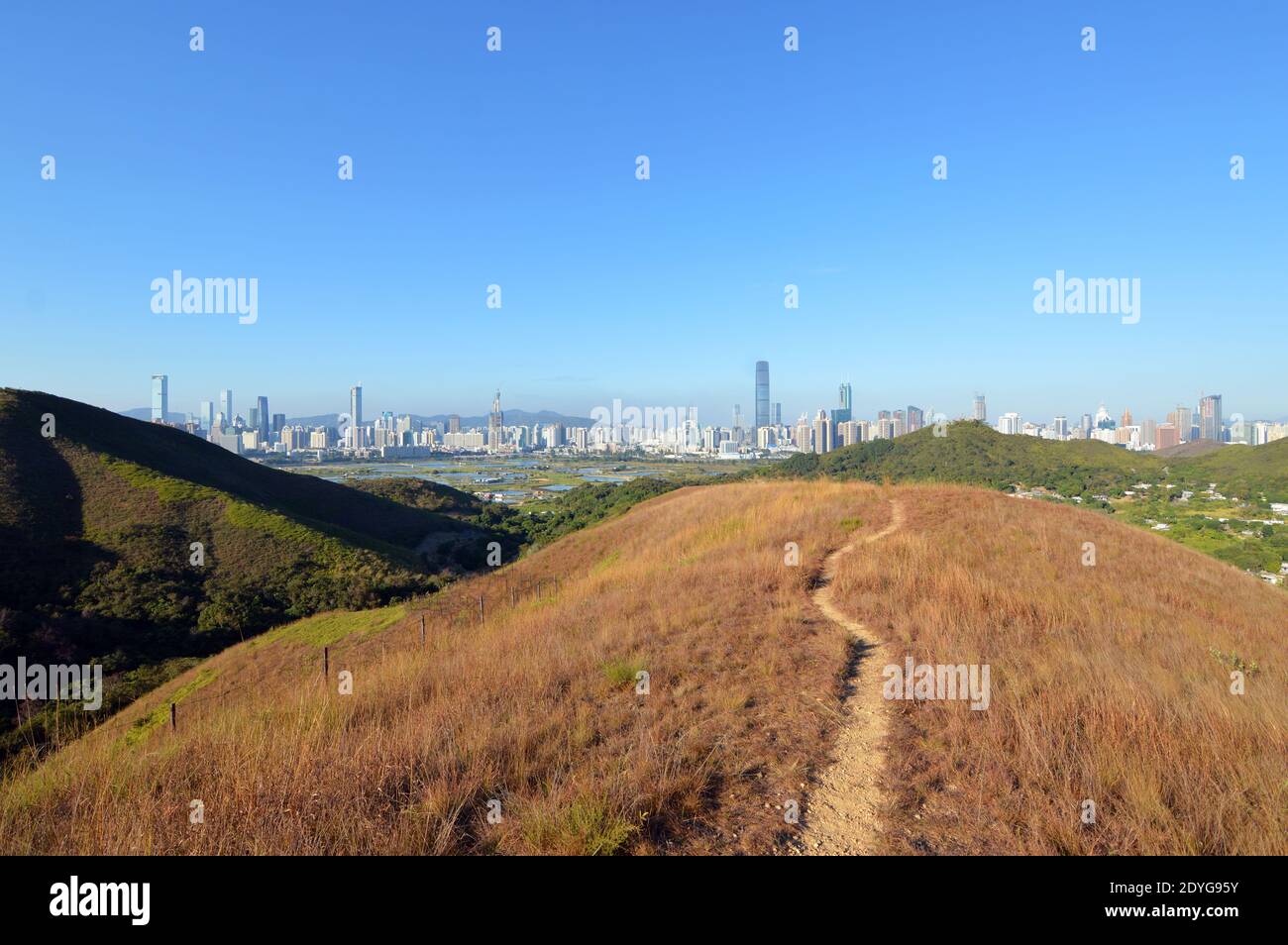 Hiking path in Lok Ma Chau, Hong Kong with skyline of Shenzhen, China ...