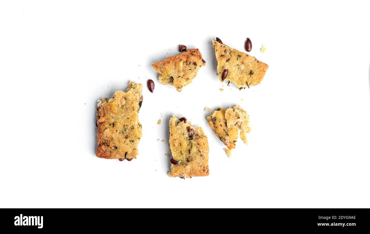 Italian crispbreads with celery, flax seeds and olive oil on a white ...