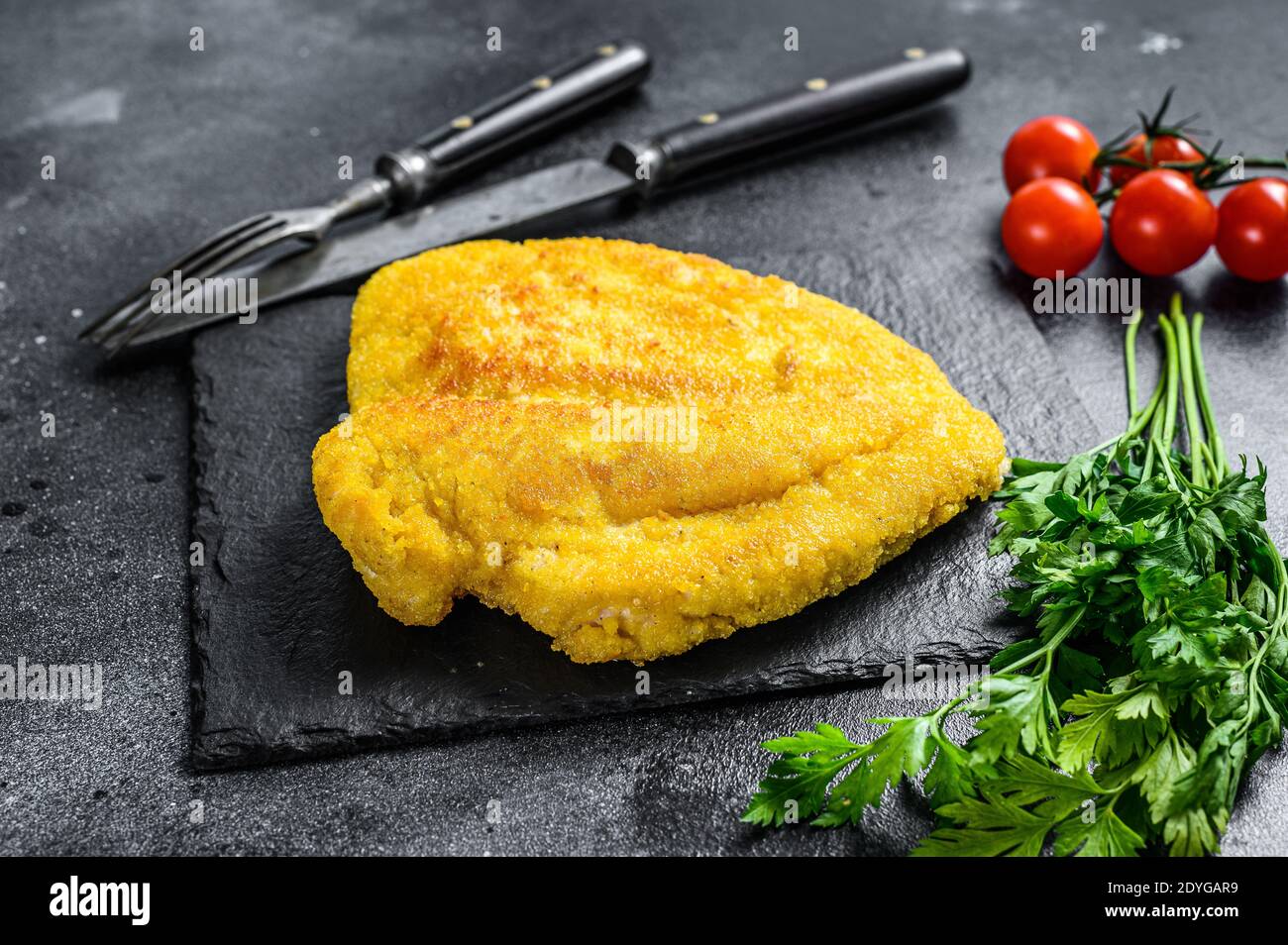 Homemade Breaded German Weiner Schnitzel. Black background. Top view ...