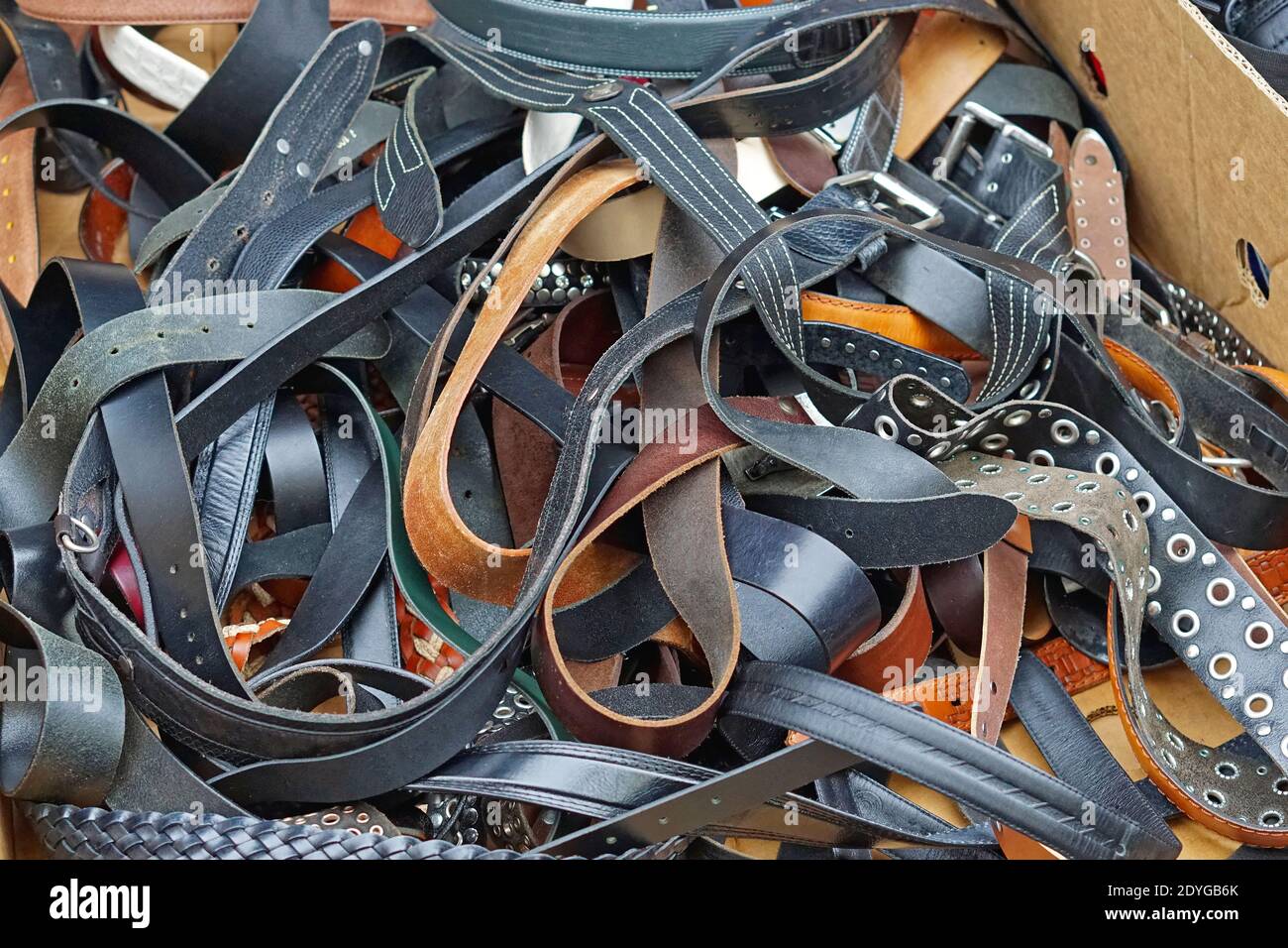 Bunch of used leather belts at flea market Stock Photo - Alamy