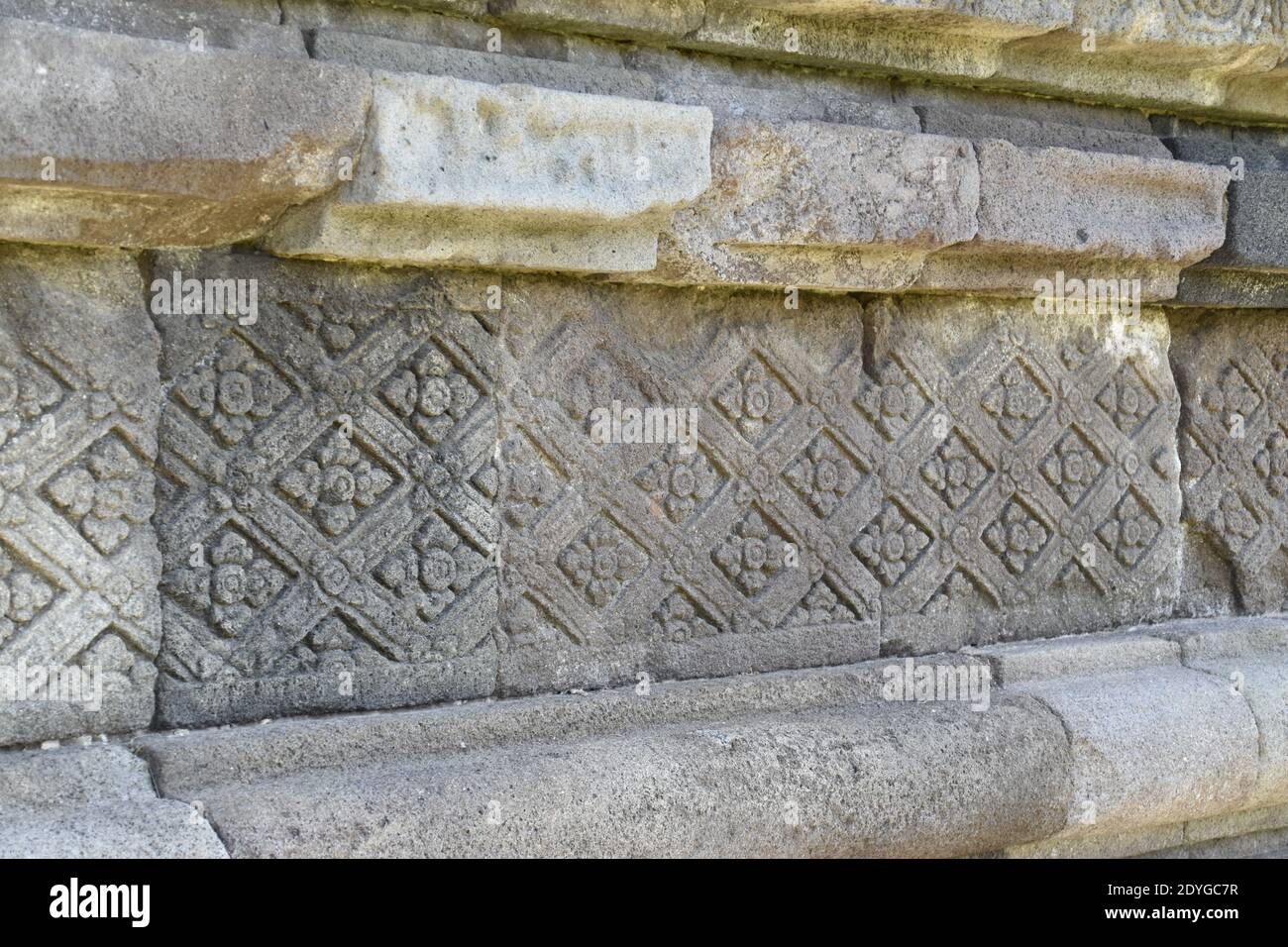 ancient art patterns at the main temple's wall in the Plaosan temple ...