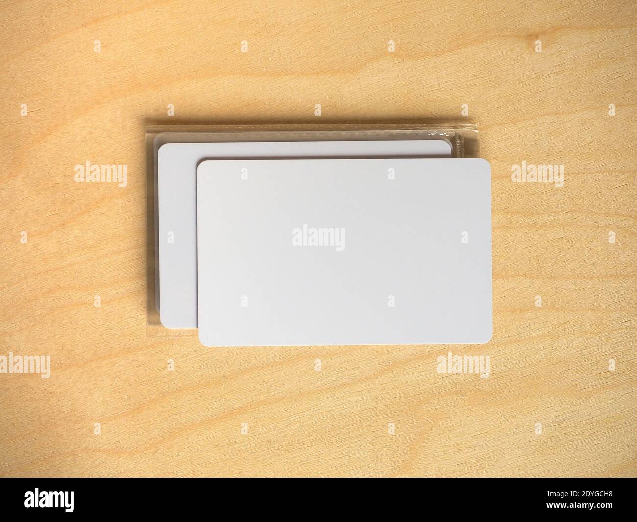 blank NFC (near field contact) cards on wooden desktop Stock Photo - Alamy
