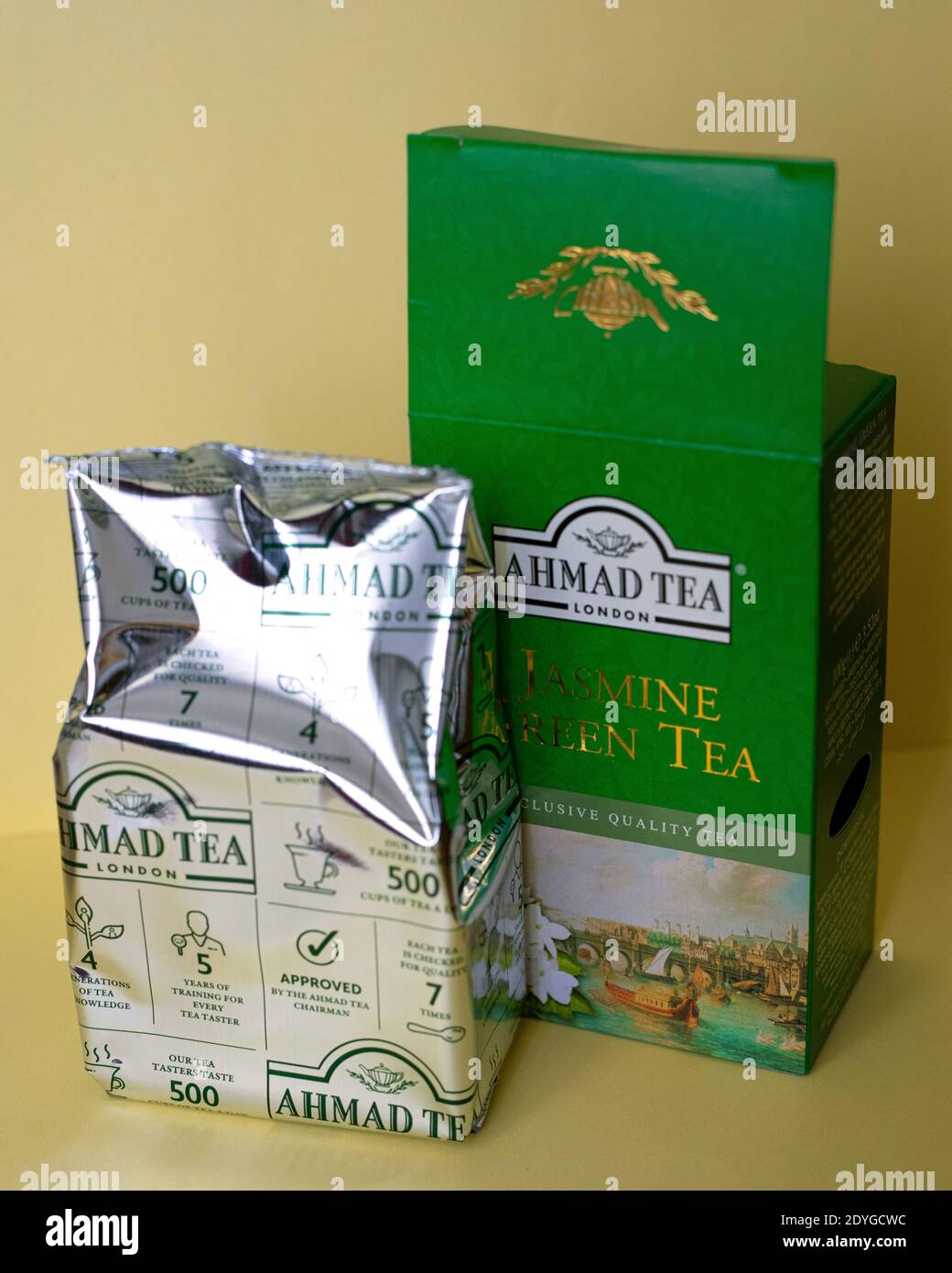 Ahmad tea. Jasmine green tea on a yellow background Stock Photo - Alamy