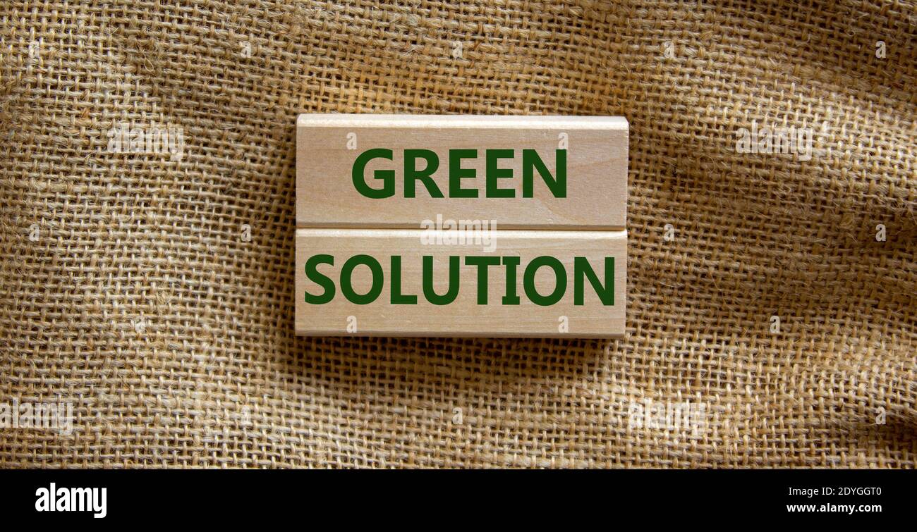 Green solution symbol. Wooden blocks form the words 'green solution' on ...