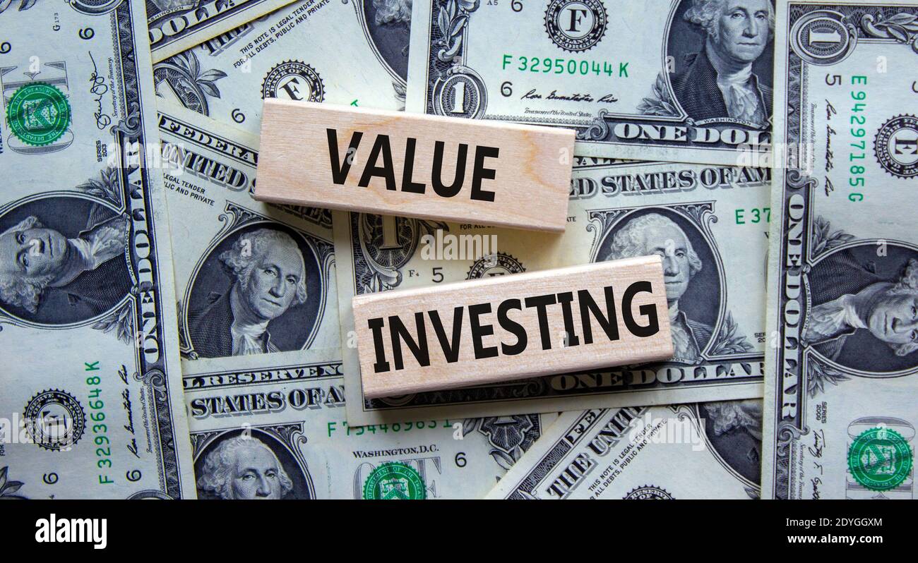 Value investing symbol. Concept words 'Value investing' on wooden ...
