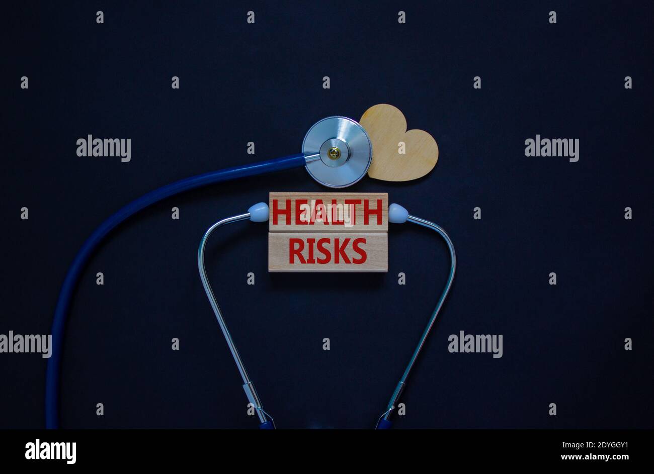 Health risks symbol. Wooden blocks with words 'Health risks' and ...