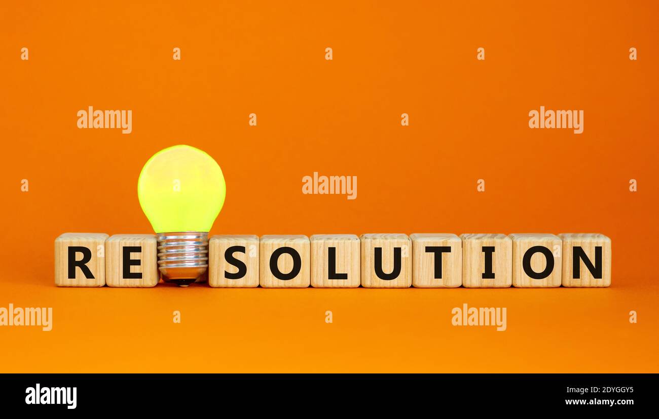 Resolution symbol. Wooden cubes with word 'resolution'. Yellow light ...