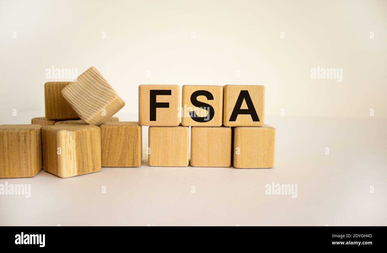FSA symbol. Concept word 'FSA - flexible spending account' on cubes on ...
